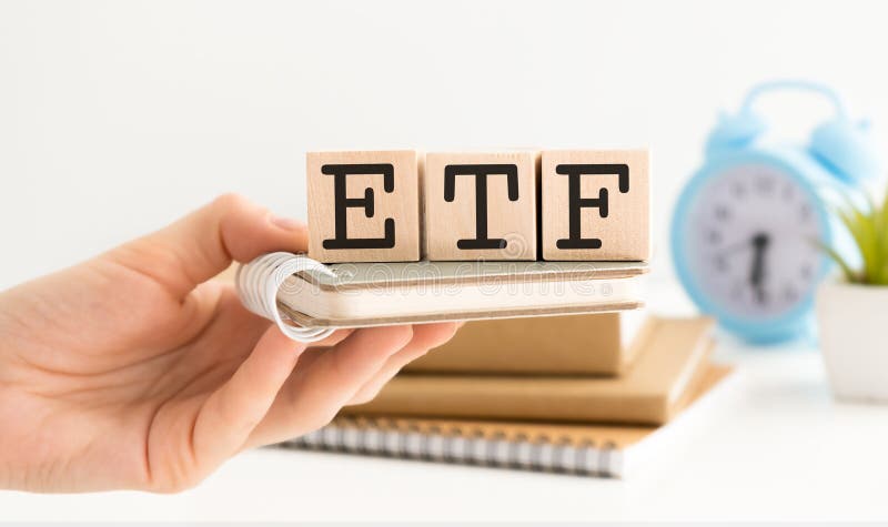 Exchange Traded Fund or ETF Concept. Holding the Top of Wooden Cube ...