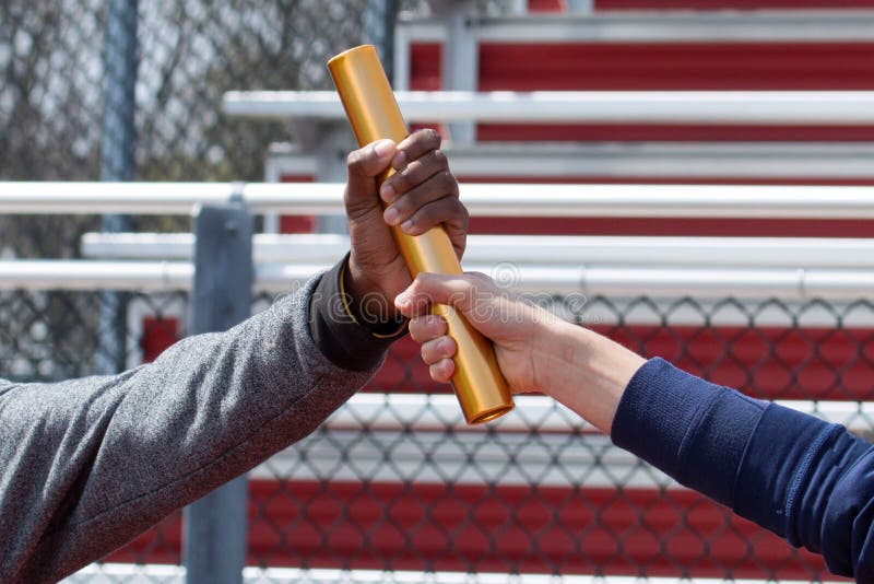Man Passing The Golden Baton To His Partner Stock Photo - Image of ...