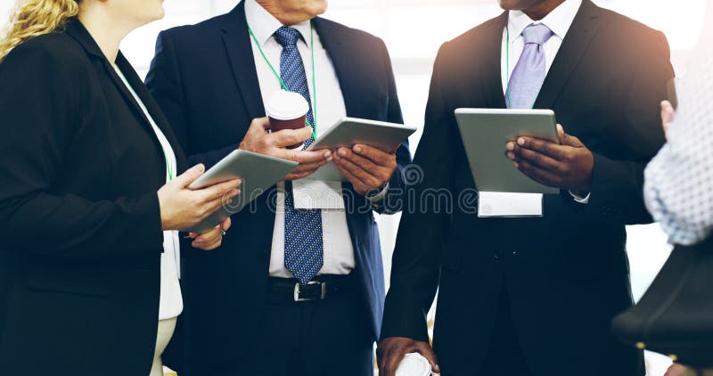 Exchanging Information. a Group of Unrecognizable Businesspeople ...