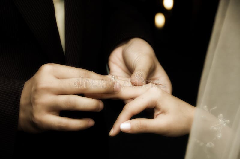 Exchanging of Rings stock image. Image of putting, surrender - 5529959