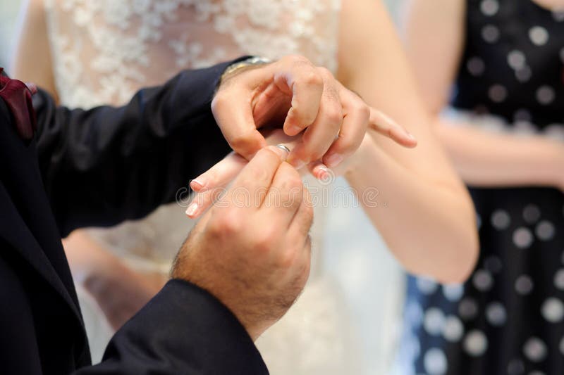 Exchanging Wedding Rings stock photo. Image of person - 36686210