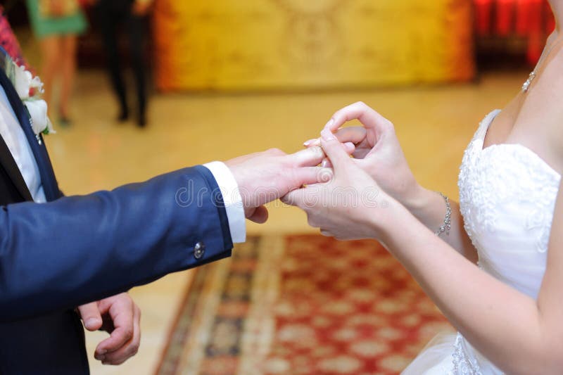 Exchanging Wedding Rings stock photo. Image of dress - 32146902