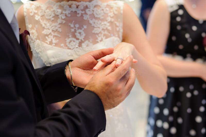 Exchanging Wedding Rings stock photo. Image of engagement - 42352982