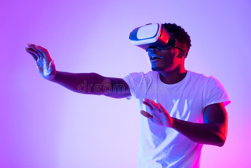 Excited African American Guy in VR Headset Using Virtual Reality ...