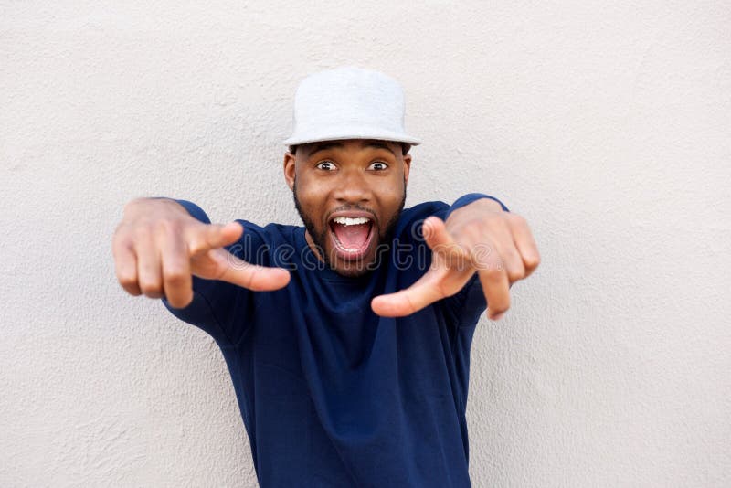 Excited African Man Pointing at Front with Surprised Expression Stock ...