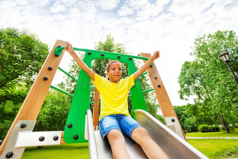 Excited Boy with Hands Up on Children Chute Stock Image - Image of ...