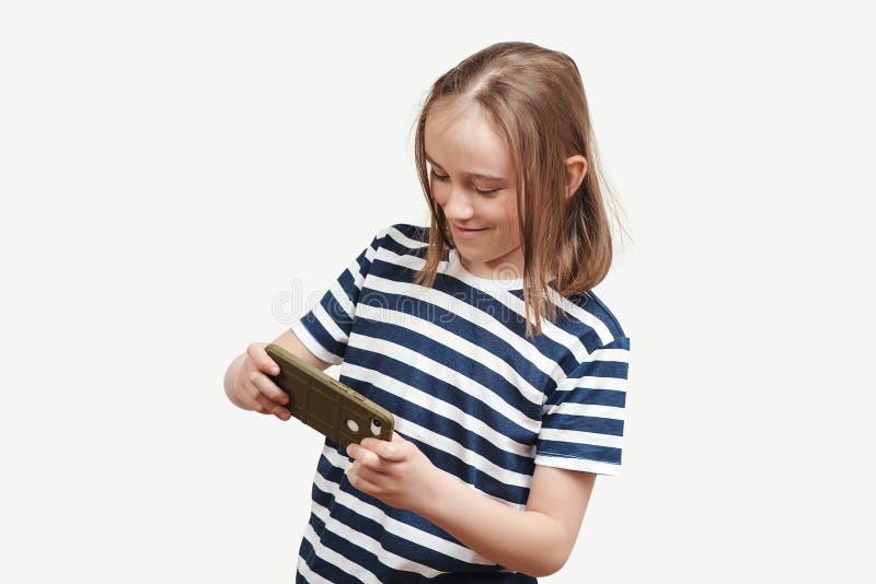 Excited Boy Playing Games on Mobile Phone. Student with Mobile Phone ...