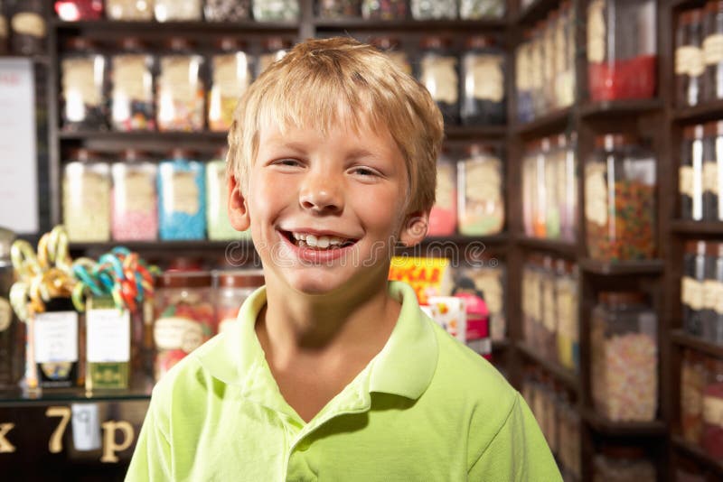 Excited Boy Standing in Sweet Shop Stock Photo - Image of confectionery ...