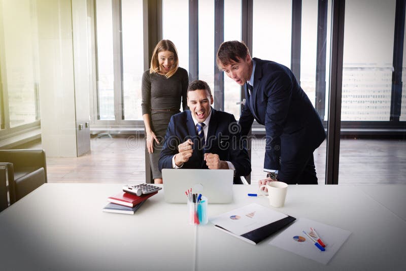 Excited Business People in Modern Office Working on Project Stock Photo ...