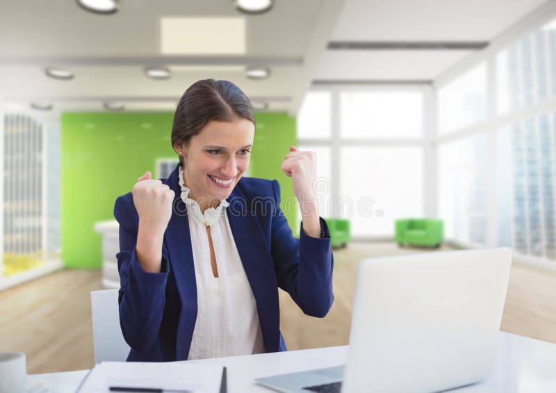 Excited Business Woman at a Desk Looking at a Computer Stock Photo ...