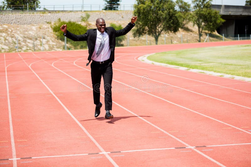 Excited Businessman Standing on the Running Track Stock Image - Image ...
