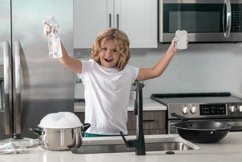 Excited Child Help in Washing Dishes at Kitchen. Stock Photo - Image of ...