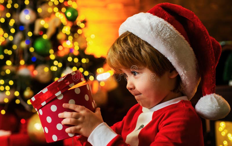 Excited Child Opening a Christmas Gift Present. Stock Photo - Image of ...