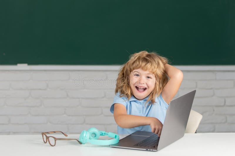 Excited Child Pupil Using Notebook Computer To Study. Stock Photo ...