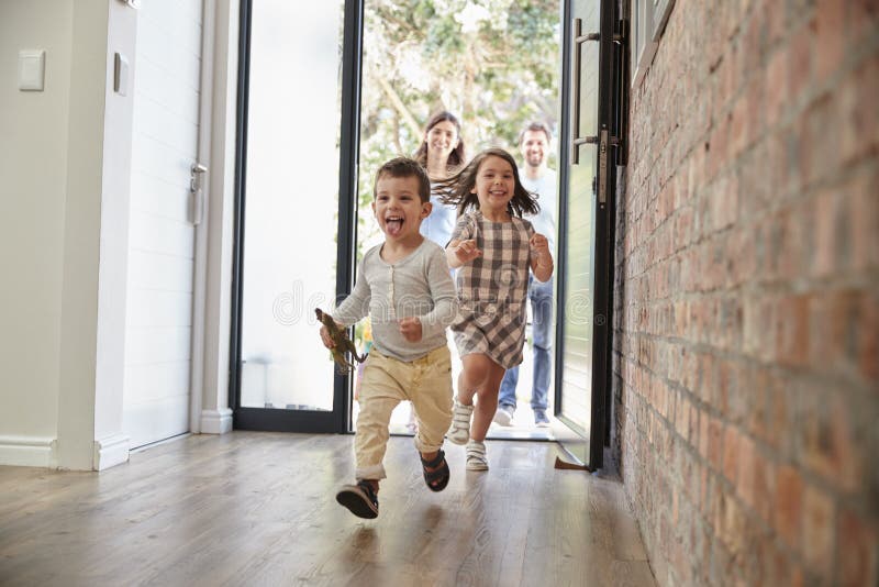 Excited Children Arriving Home with Parents Stock Image - Image of ...