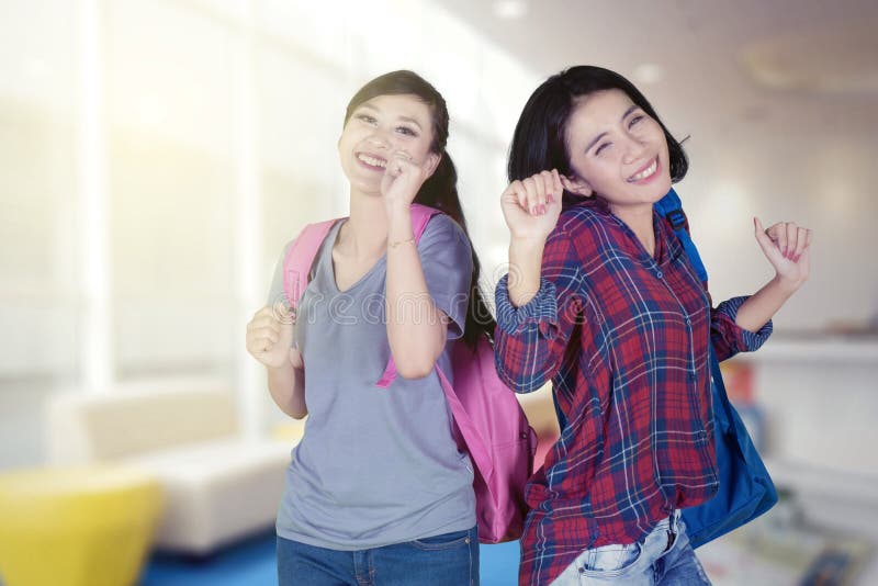 Excited College Students Dancing in the Library Stock Image - Image of ...