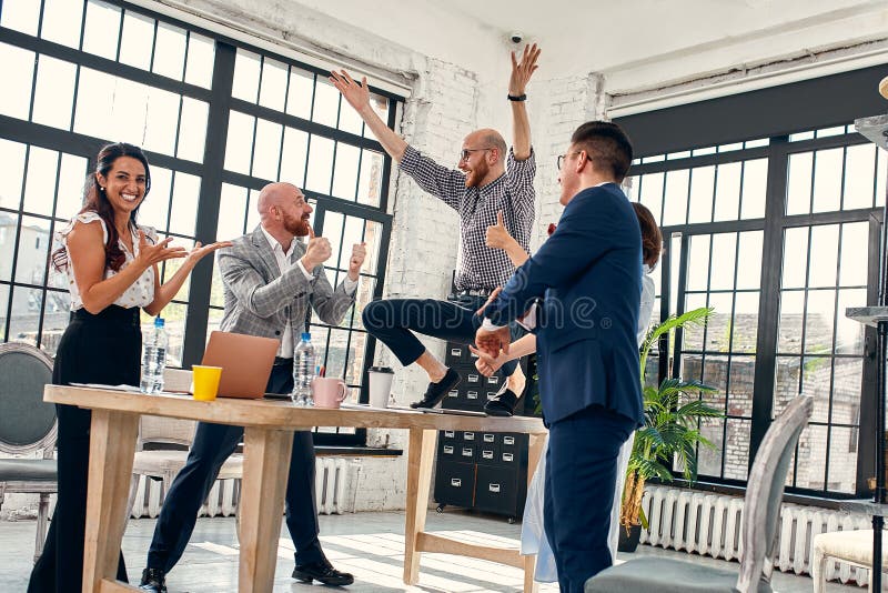 Excited Diverse Business Team Employees Screaming Celebrating Good News ... Excited Diverse Business Team Employees Screaming Celebrating Good News ...