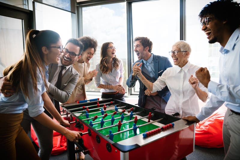 Excited Diverse Employees Enjoying Funny Activity at Work Break ...