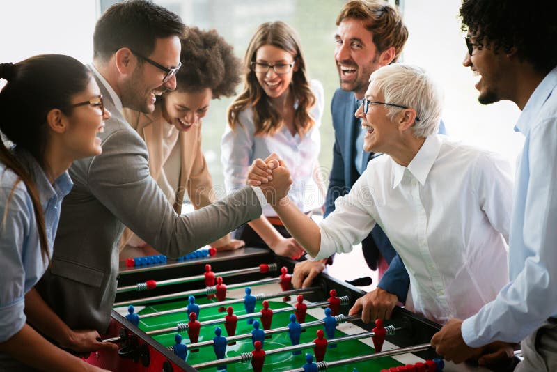 Excited Diverse Employees Enjoying Funny Activity at Work Break ...