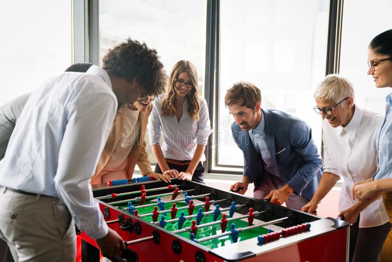 Excited Diverse Employees Enjoying Funny Activity at Work Break ...