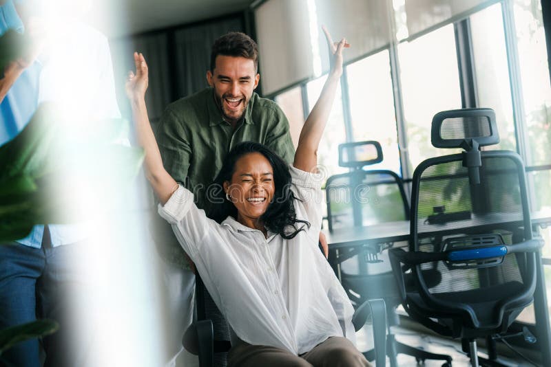 Excited Diverse Employees Laughing Enjoying Funny Activity at Work ...