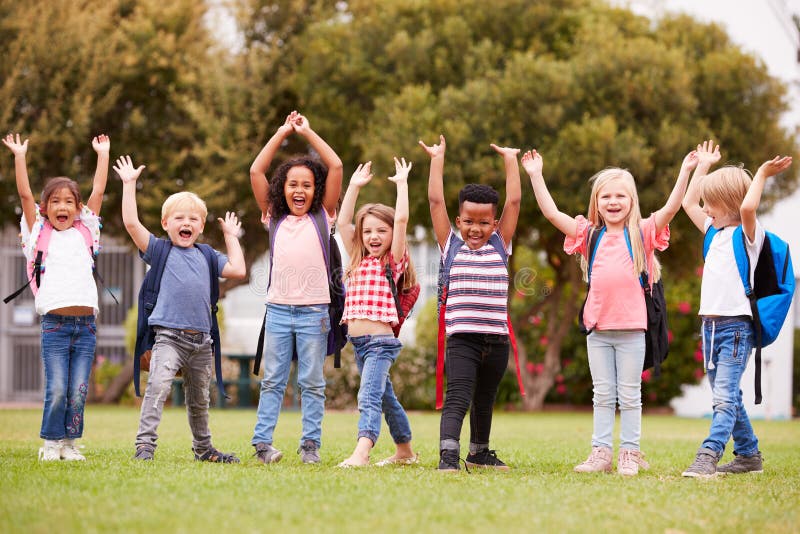 Excited Elementary School Pupils on Playing Field at Break Time Stock ...