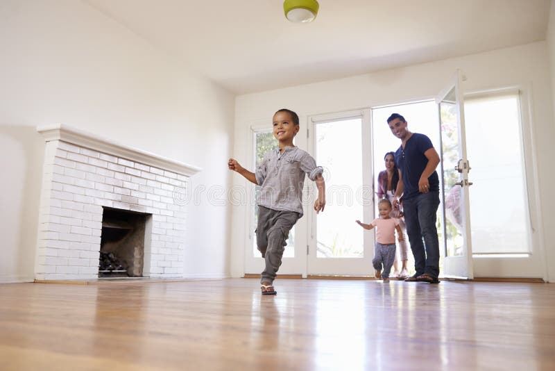 Excited Family Explore New Home on Moving Day Stock Image - Image of ...