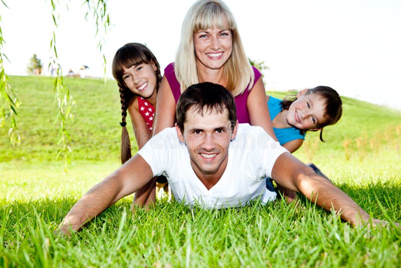 Excited parents with kids stock image. Image of field - 21732333