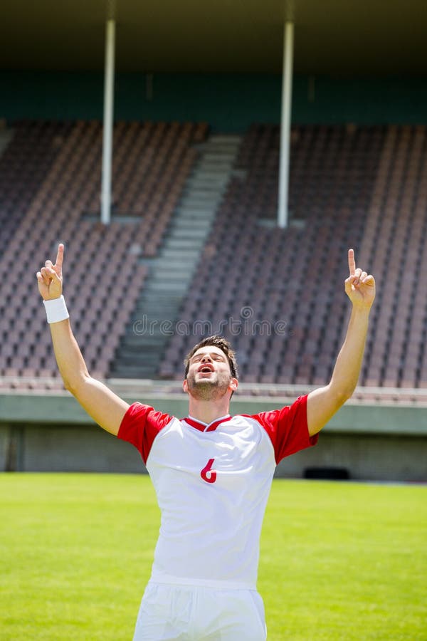 Excited Football Player with Hands Raised Stock Photo - Image of sports ...