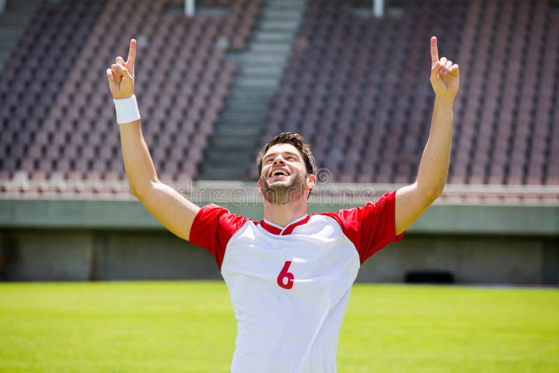 Excited Football Player with Hands Raised Stock Image - Image of ...