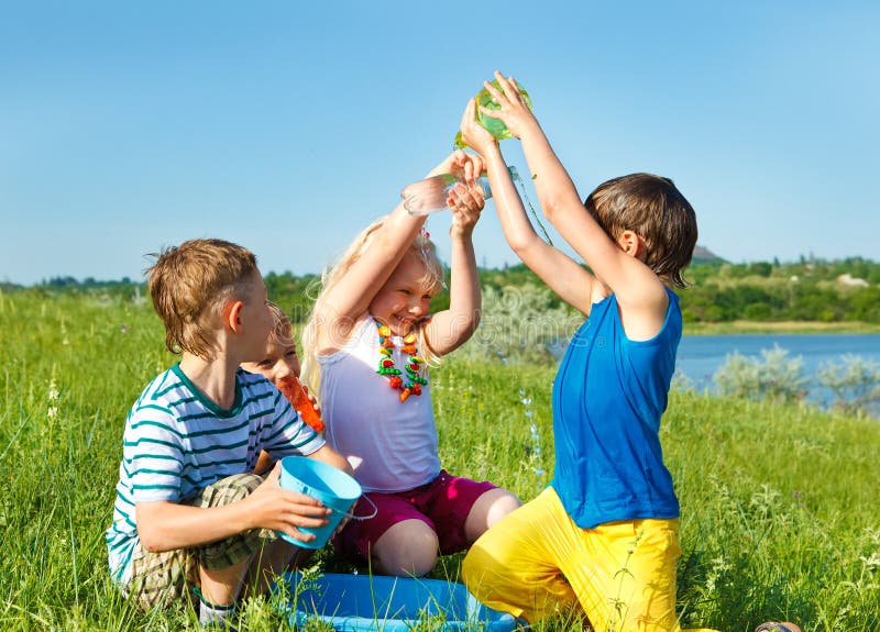 Excited Friends Pouring Water Stock Image - Image of interest ...