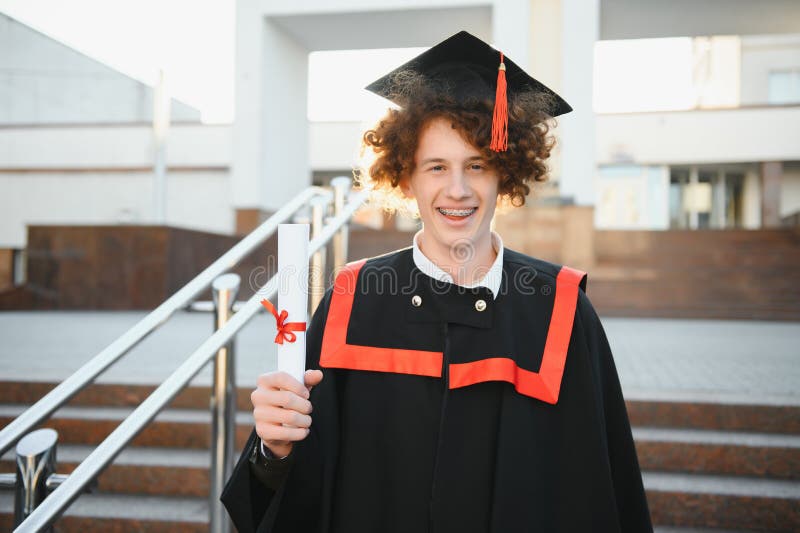 Excited Graduate Student in Gown with Risen Hands Holding Diploma ...