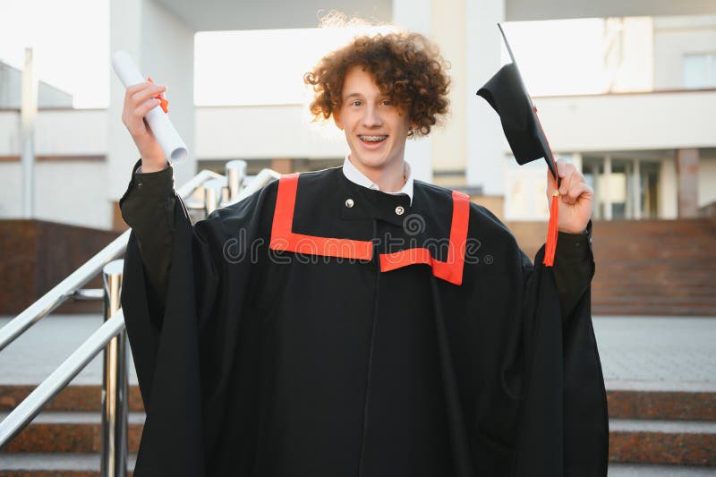 Excited Graduate Student in Gown with Risen Hands Holding Diploma ...