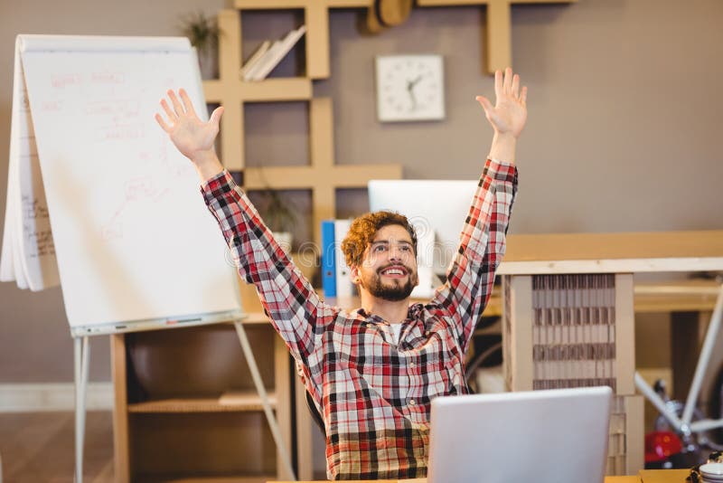 Excited Graphic Designer Sitting with Laptop Stock Photo - Image of ...