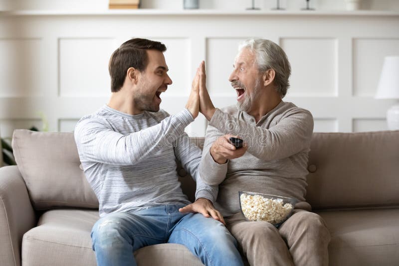 Head Shot Portrait Adult Son Hugging Mature Father From Back Stock