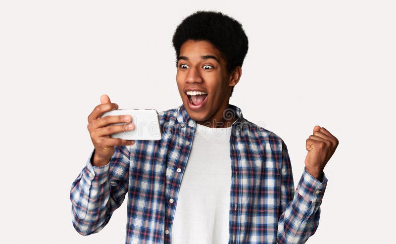 Excited Guy Celebrating Success, Winning Game on Phone Stock Image ...