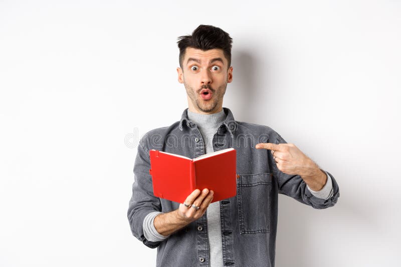 Excited Guy Read Interesting Thing in Journal, Pointing at Planner and ...