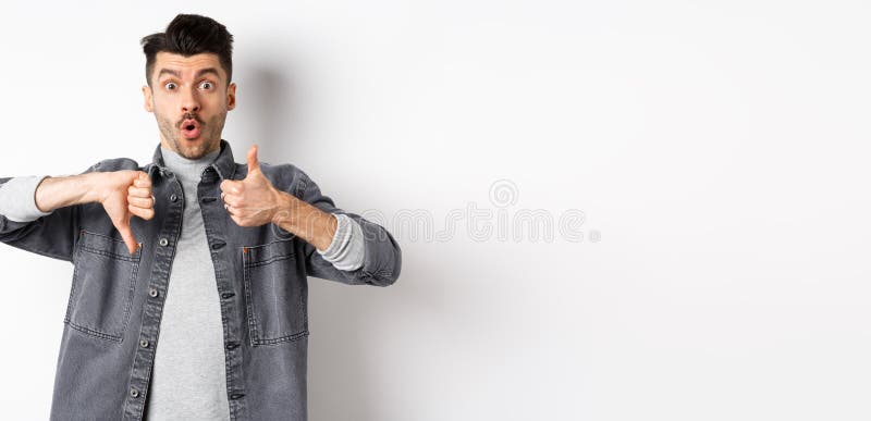 Excited Guy Show Thumbs Up and Down Judging and Making Decision, Rate ...