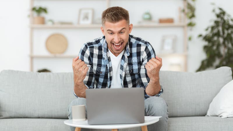 Excited Handsome Guy Feeling Ecstatic Using Pc Stock Photo - Image of ...
