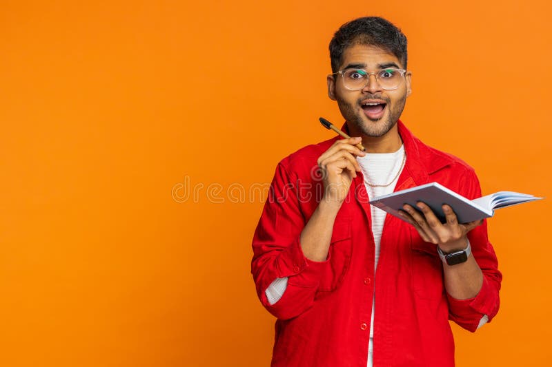 Excited Happy Indian Man Making Notes Writing Down Thoughts with Pen ...