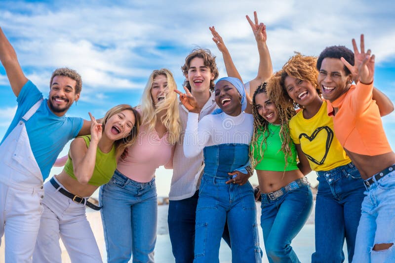 Excited and Happy Multi-ethnic Friends Posing Standing Together Stock ...