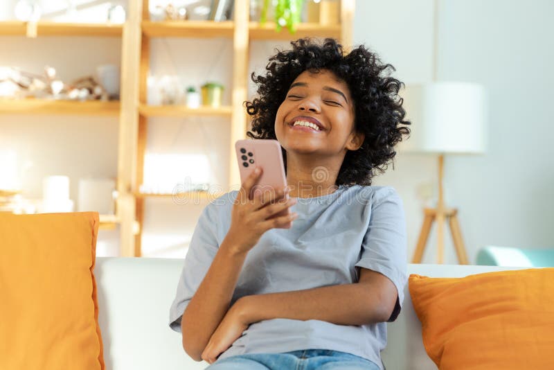 Excited Happy Young Black African American Woman Holding Cell Phone
