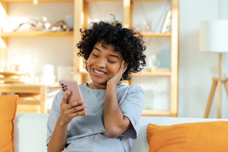 Excited Happy Young Black African American Woman Holding Cell Phone