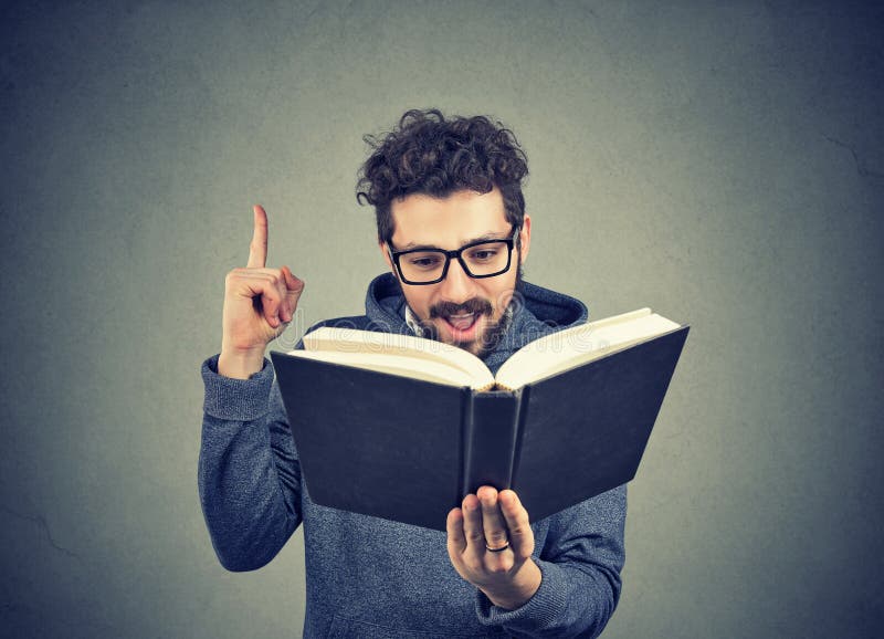 Excited Hipster Guy Reading a Book Stock Image - Image of looking ...