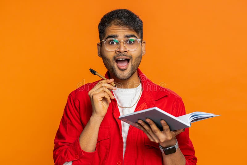 Excited Indian Man Making Notes, Writing Down Thoughts with Pen into ...