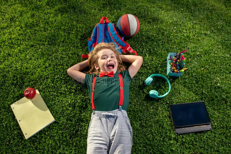 Excited Kid Learn Online in Virtual School Using Tablet on Green Grass ...