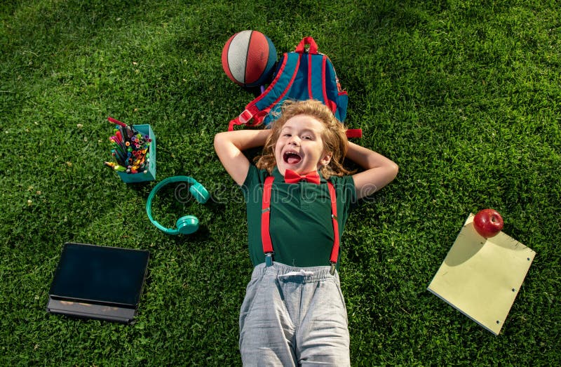 Excited Kid Learn Online in Virtual School Using Tablet on Green Grass ...