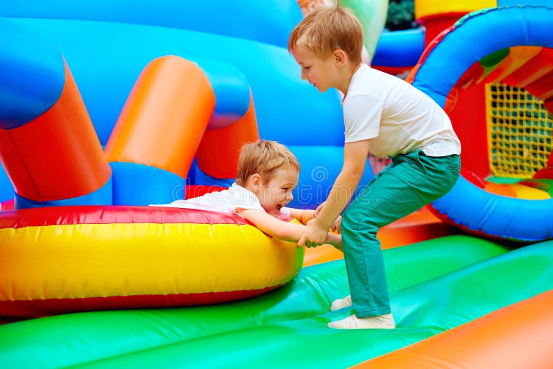 Excited Kids Having Fun on Inflatable Attraction Playground Stock Photo ...
