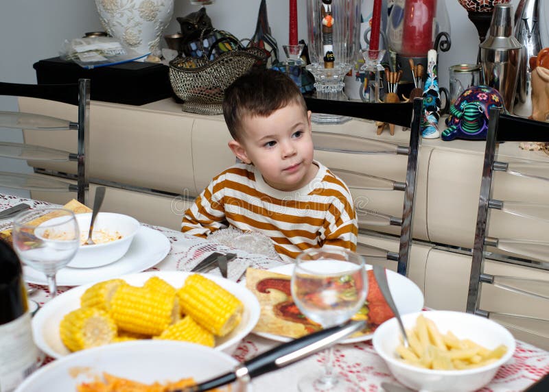 Excited Little Boy Sitting at the Thanksgiving Table Stock Image ...