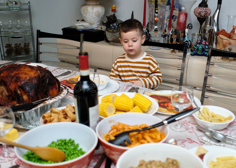 Excited Little Boy Sitting at the Thanksgiving Table Stock Photo ...
